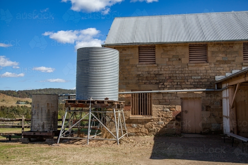 Image of Rainwater tank and historical building on Tocal farm ...