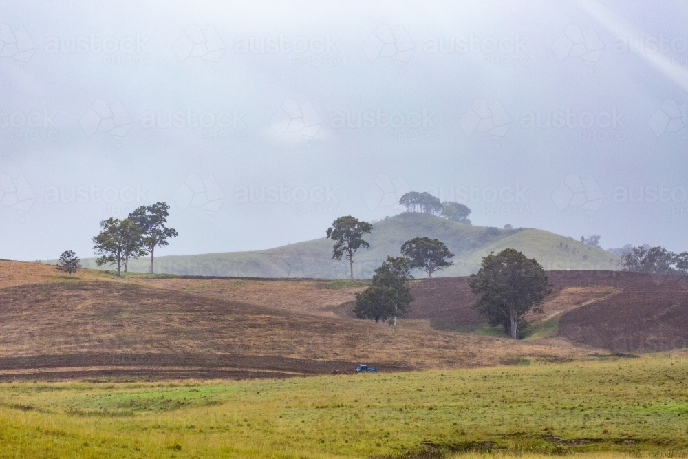 Image of Rainy day with rain falling on newly ploughed paddock ...