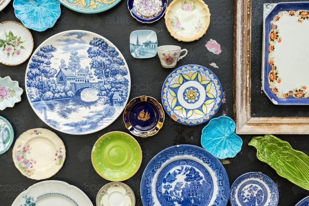 Image of random china and things stuck to a wall - Austockphoto