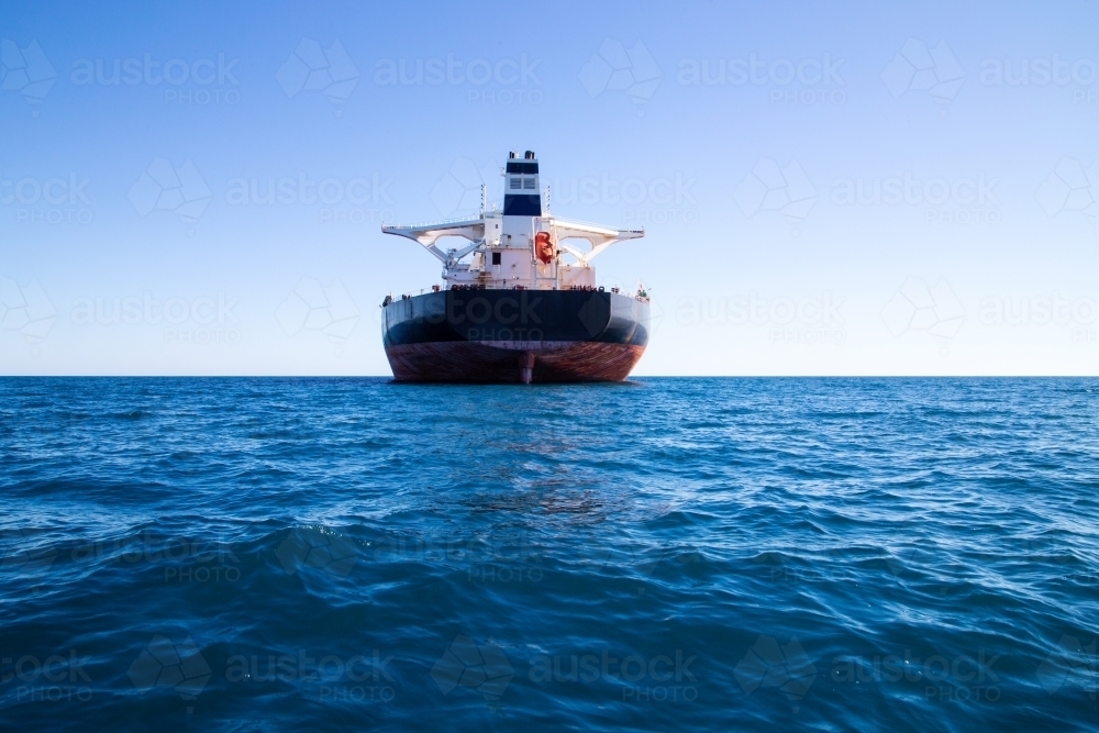 Image of Rear view of freight ship offshore - Austockphoto