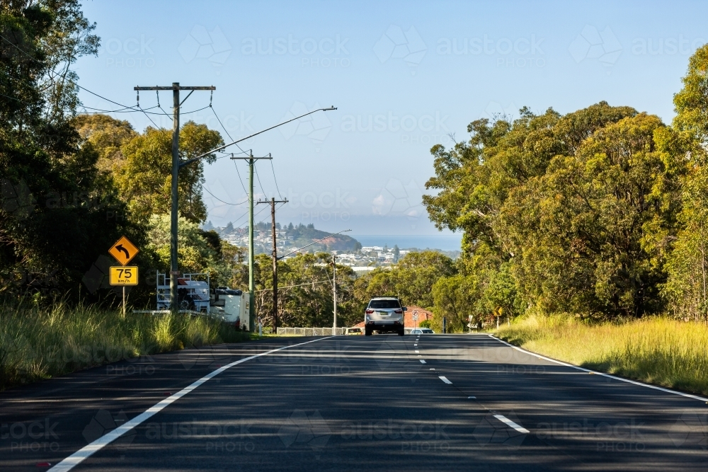 Image of recommended speed of 75 km/h on bend in coastal Newcastle road ...