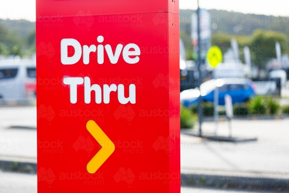 Image of red and yellow Drive Thru sign and arrow at fast food store ...