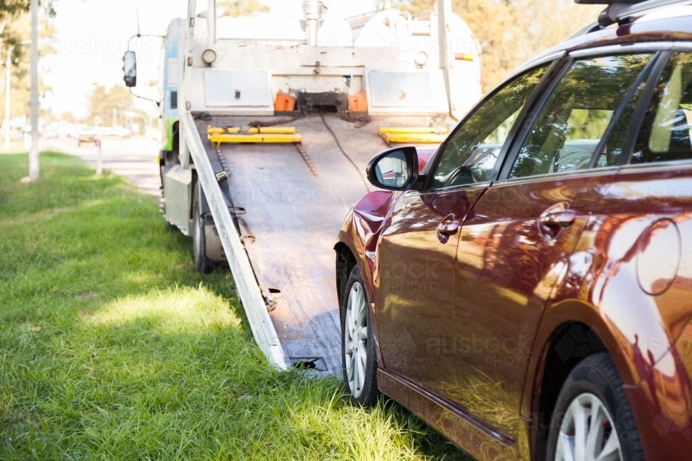 Image of Red car after a front end collision road accident being towed ...