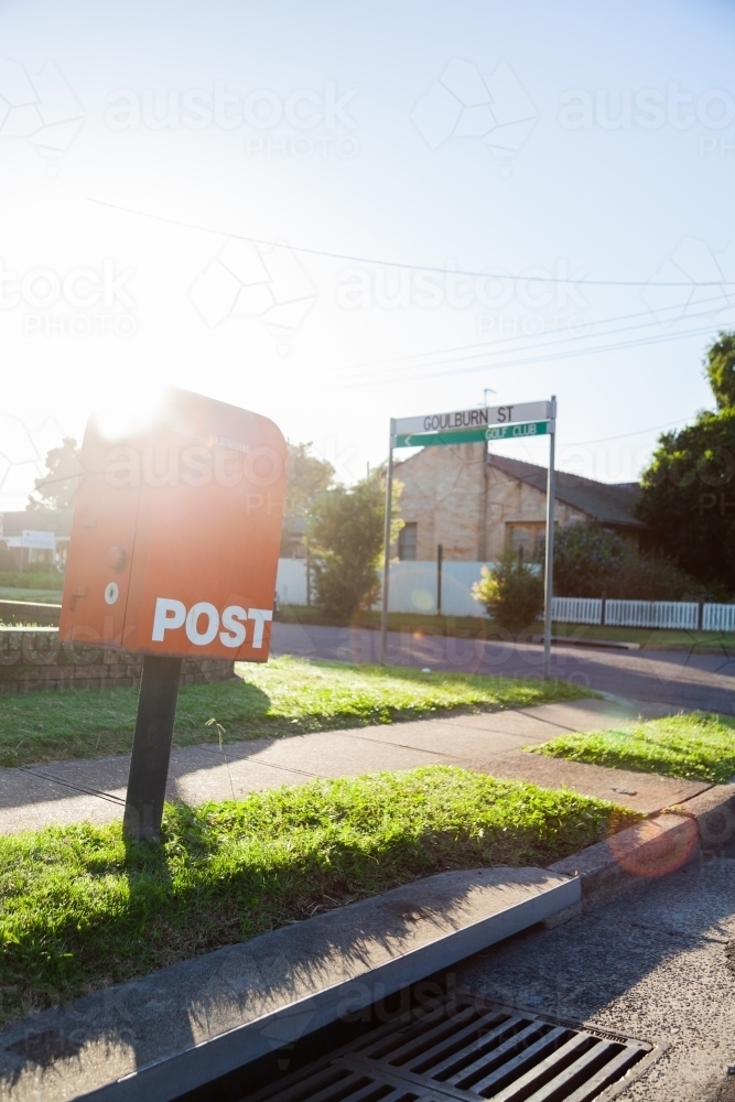 Image of Red post box on Australian street with morning sunlight ...