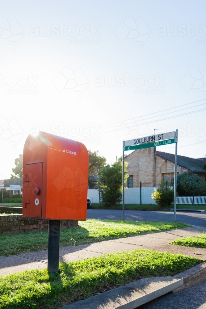 Image of Red post box on Australian street with morning sunlight ...