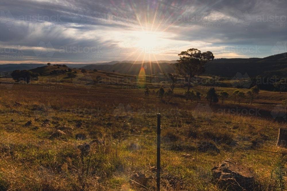 Image of Regional NSW sunset landscape with wind turbines on ridgeline ...