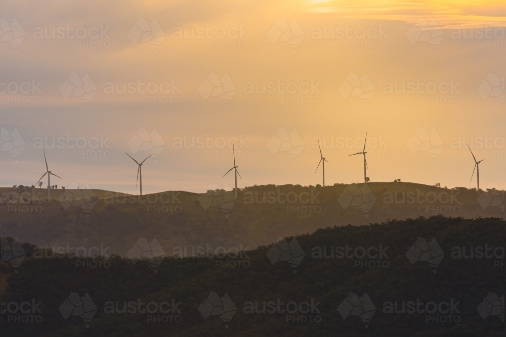 Image of Regional NSW sunset landscape with wind turbines on ridgeline ...