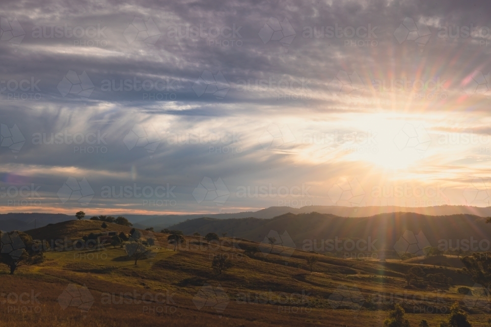 Image of Regional NSW sunset landscape with wind turbines on ridgeline ...