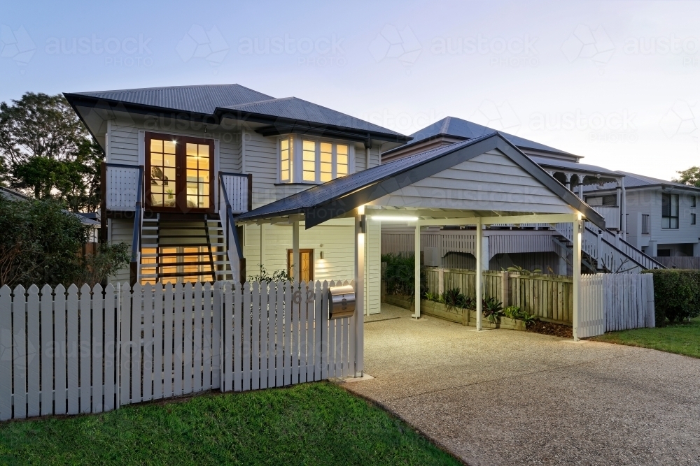 Image of Renovated Queenslander home at twilight - Austockphoto