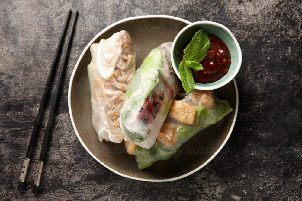 Image of Rice paper rolls dish on table - Austockphoto