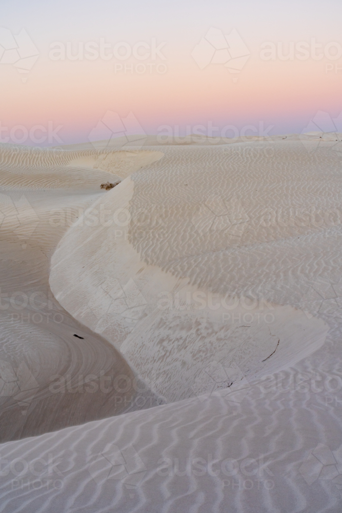 Image of Ripples and patterns on the side of white sand dunes at ...