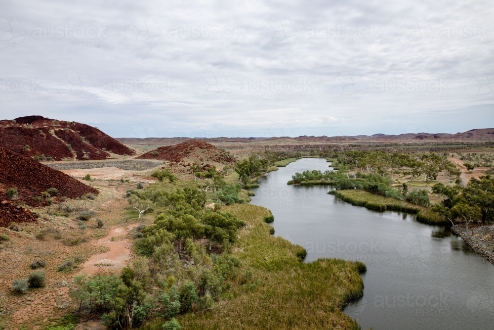 Image of river in the Pilbara under cloudy sky - Austockphoto