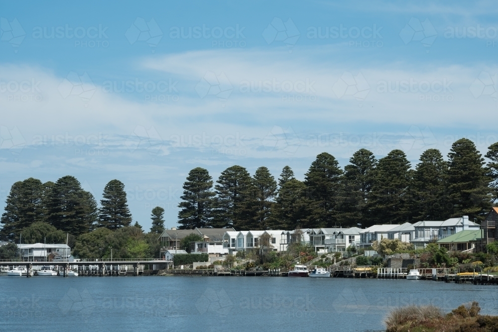 Image of River view with houses - Austockphoto