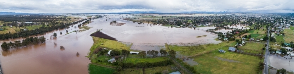 Image of River with broken banks during flood with floodwater covering ...