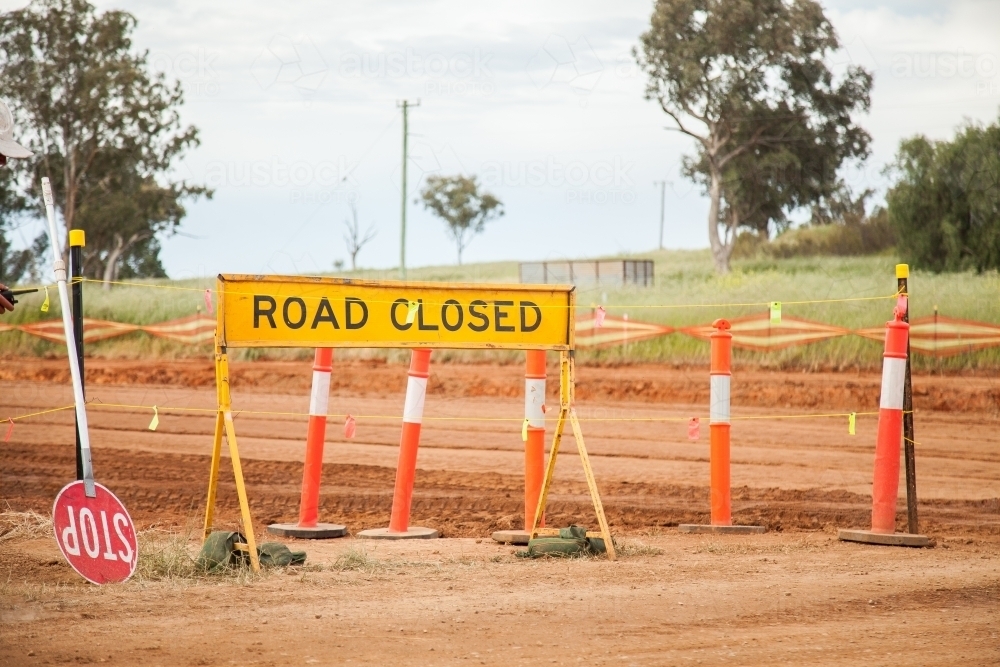 Image of Road closed and stop sign beside roadworks - Austockphoto