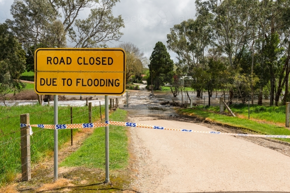 Image of road closed due to flooding - Austockphoto