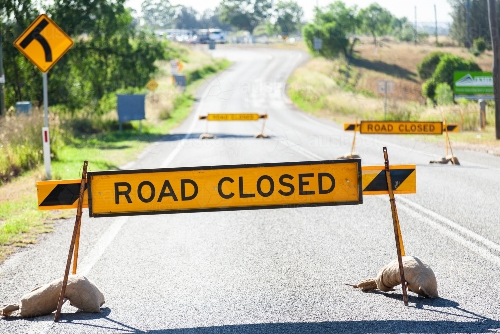 Image of Road closed signs across road - Austockphoto