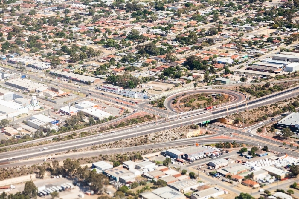 Image of Road highway with off ramp and bridge beside industrial area ...