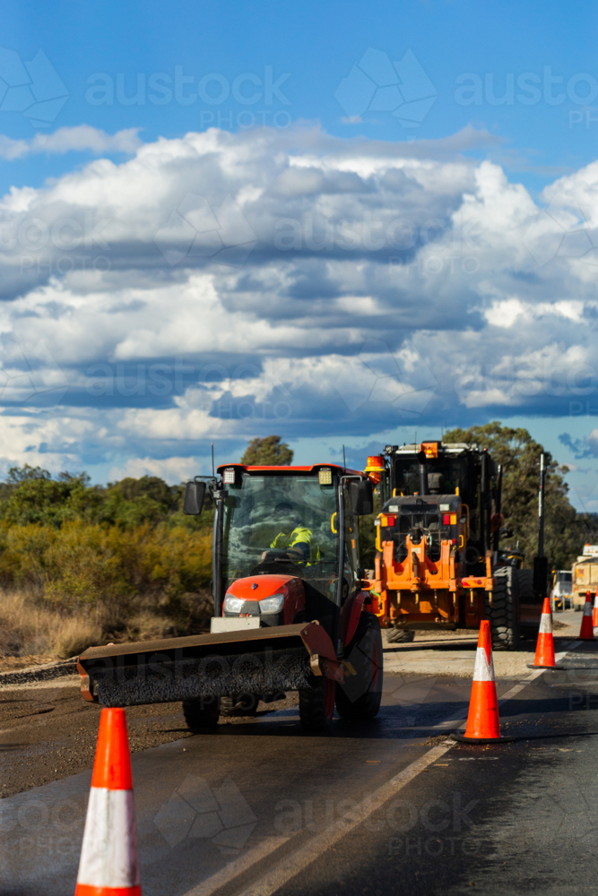 Image of road resurfacing earthworks machinery on worksite beside rural ...