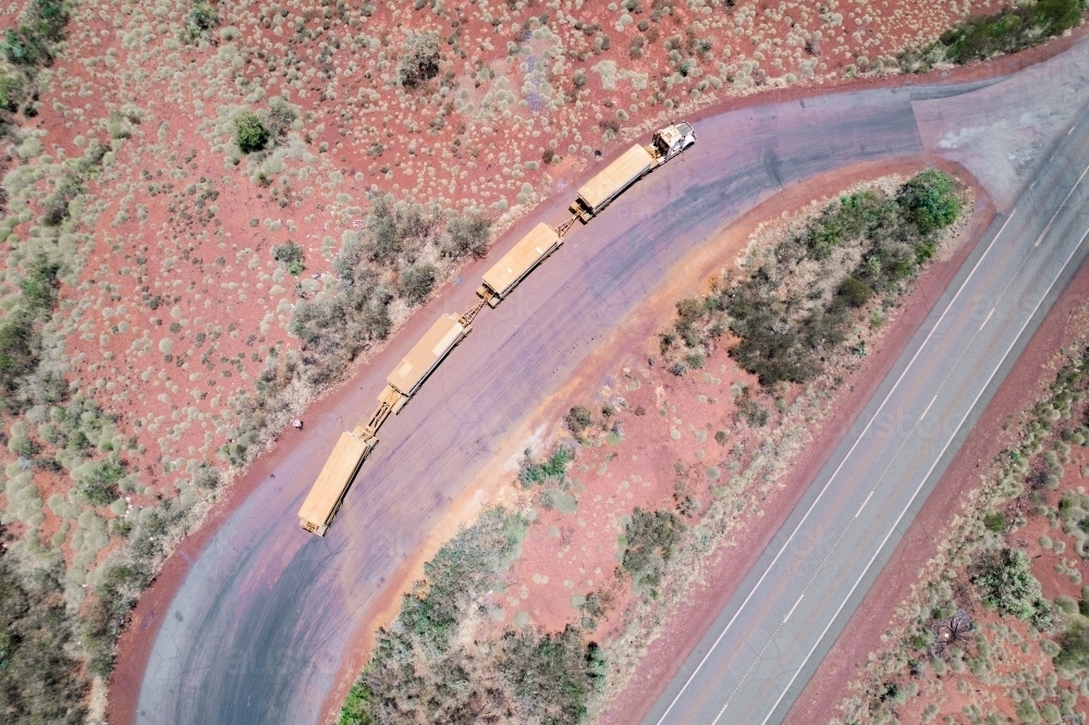 Image of Road train stopped at a truck resting area next to the asphalt ...