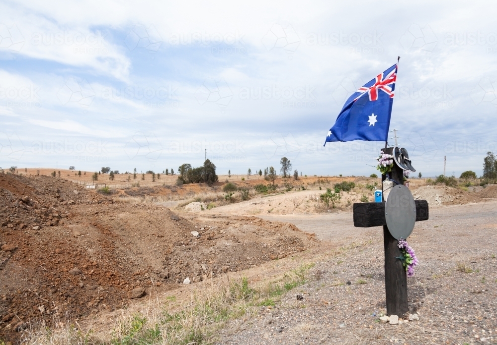Image of Roadside memorial cross with Australian flag - Austockphoto