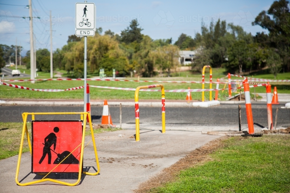 Image of Roadwork sign on footpath before taped off work-site area ...
