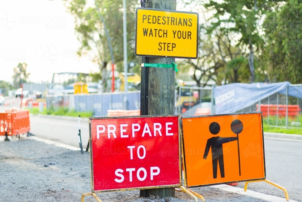Image of Roadwork signs along street, prepare to stop, pedestrians ...