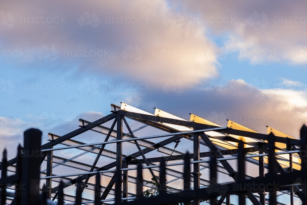 Image of roof frame beams of building under construction - Austockphoto