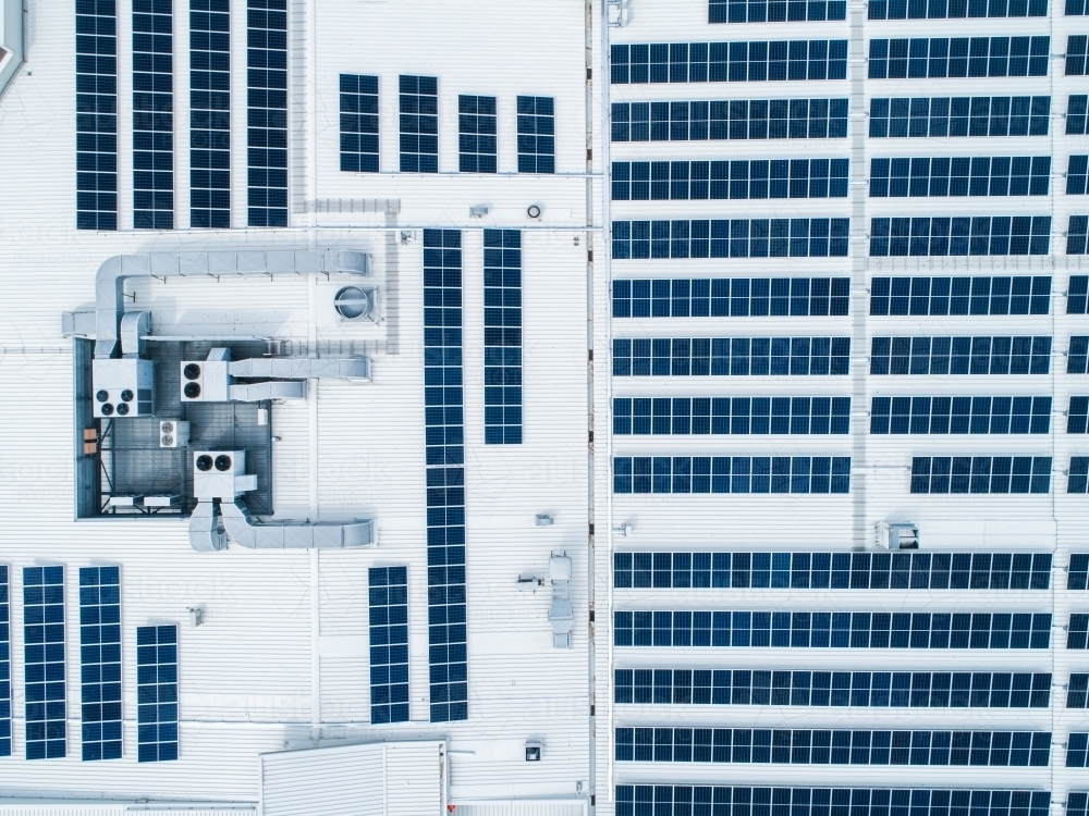 Image of Roof of shopping center covered in solar panels - Austockphoto