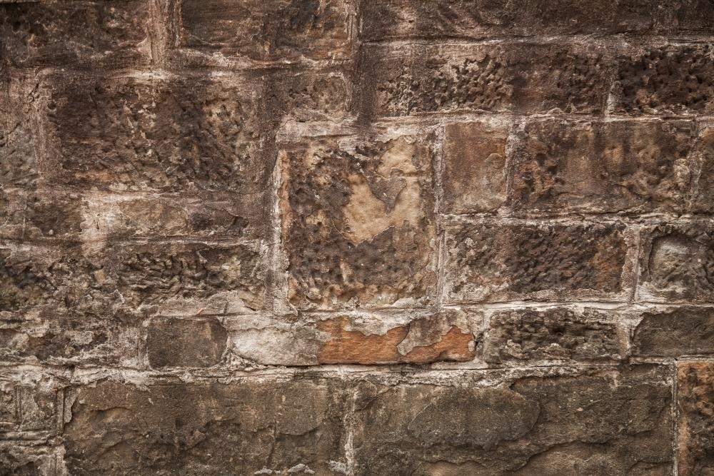 Image of Rough brick textured stone wall - Austockphoto