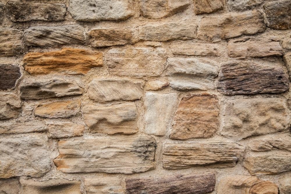 Image of Rough brick textured stone wall - Austockphoto