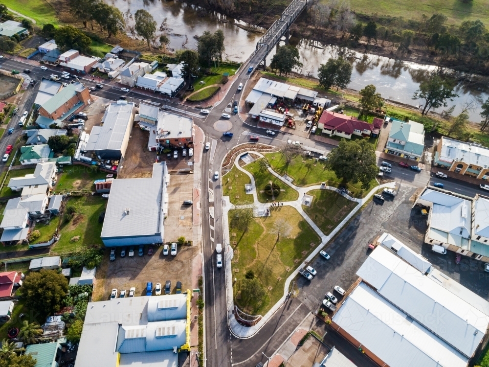 Image of Roundabout and park with buildings beside Hunter river and ...