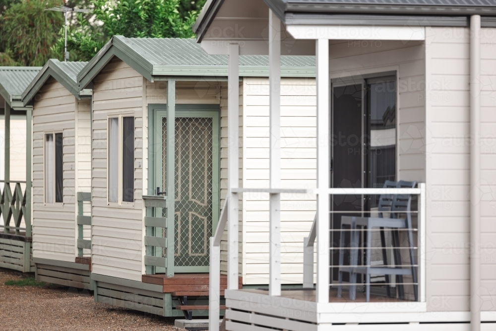 Image of Row of holiday accommodation cabins in a caravan park ...