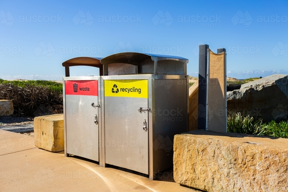 Image of Rubbish and recycling bins in sunlight beside the walk on ...