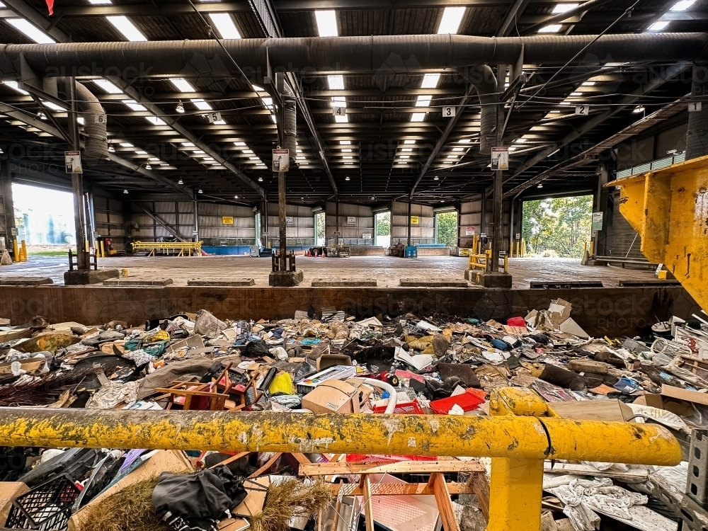 Image of rubbish inside a waste management facility - Austockphoto