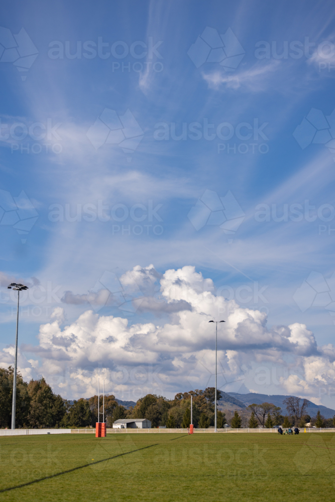 Image of Rugby league field in country town under blue cloudy sky ...