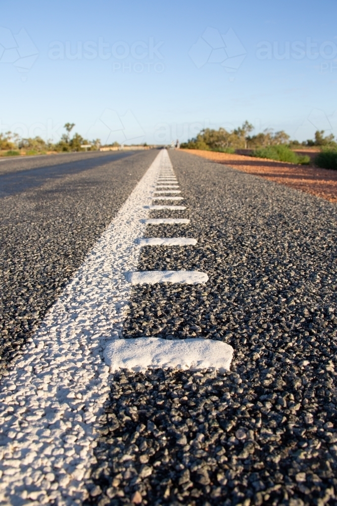 Image of Rumble strip on the side of an outback highway - Austockphoto