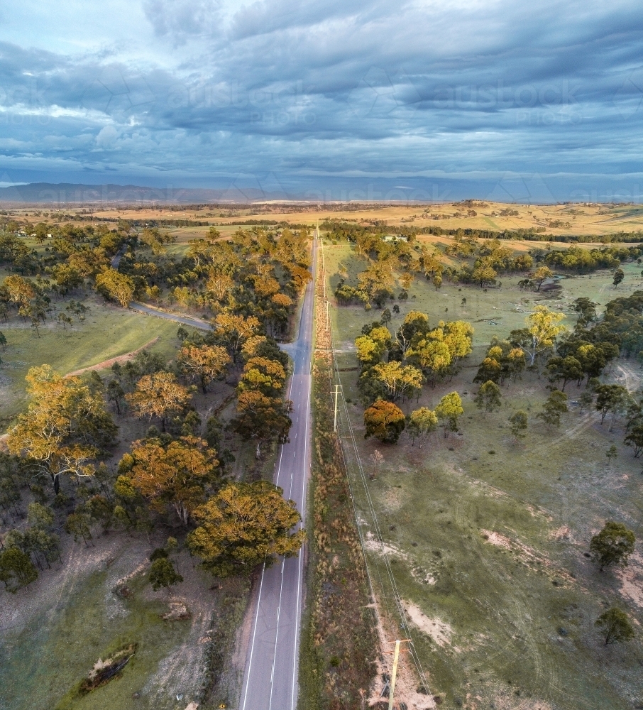 Image of Rural country road leading to the horizon - Austockphoto
