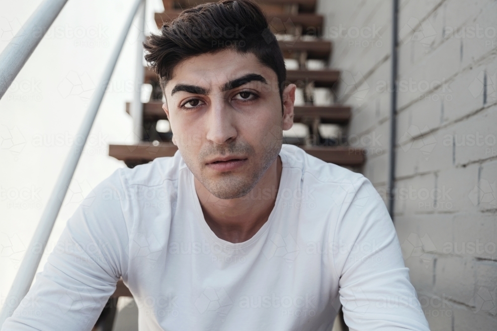 Image of Sad multicultural young adult man - Austockphoto