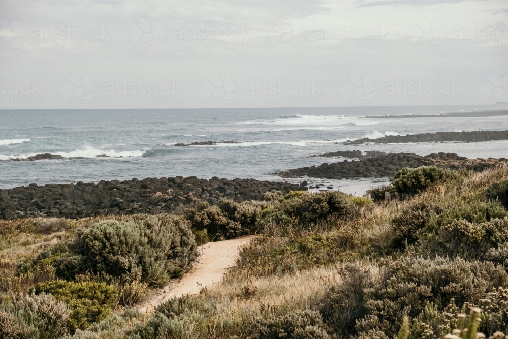 Image of Sandy track to the ocean. - Austockphoto