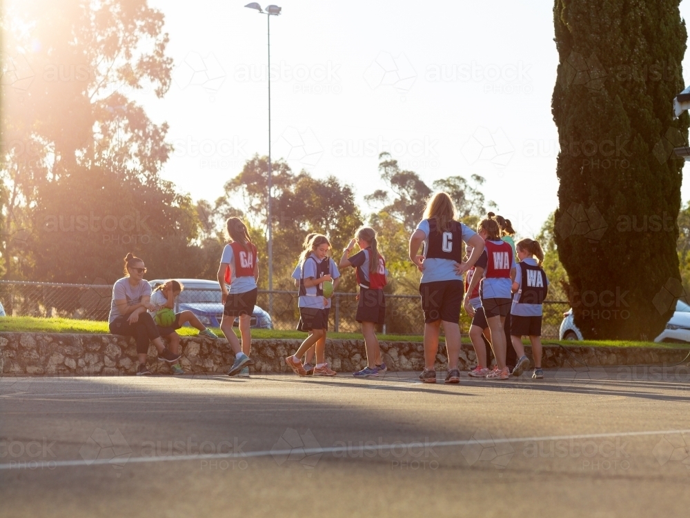 Image of School children playing netball - Austockphoto