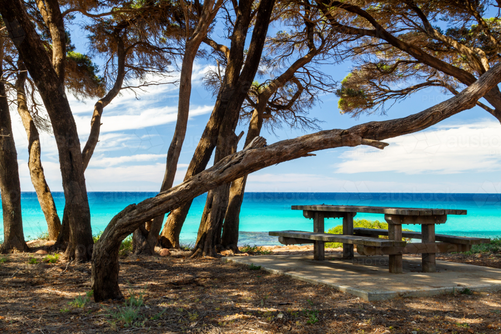 Image of Seaside picnic table and turquoise sea. - Austockphoto