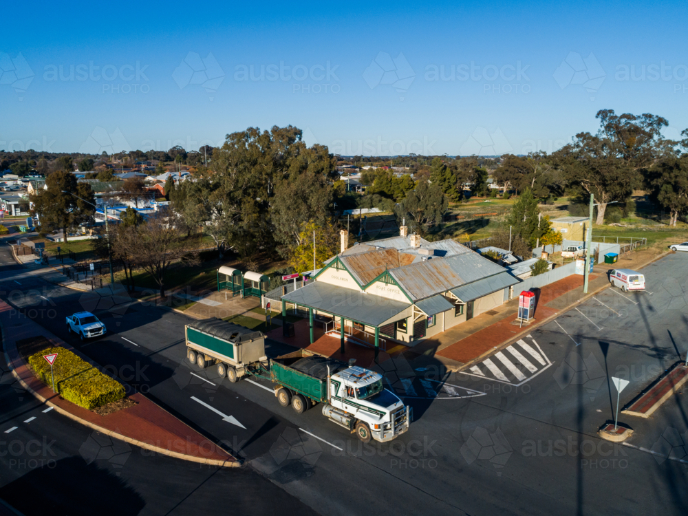 Image of Semi-trailer truck driving through rural country town of ...
