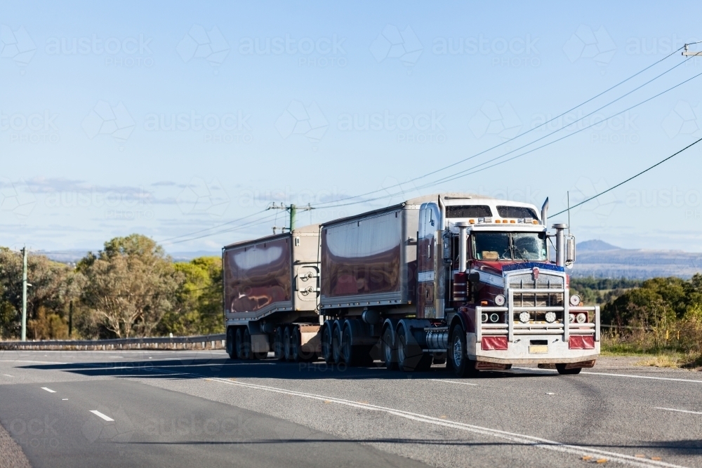 Image of Semi trailer truck transporting goods on highway in Australia ...
