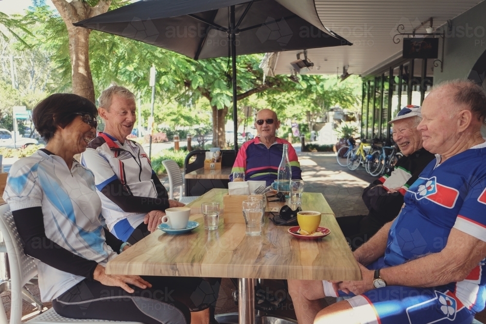 Image of Senior cyclists having coffee after bike ride - Austockphoto