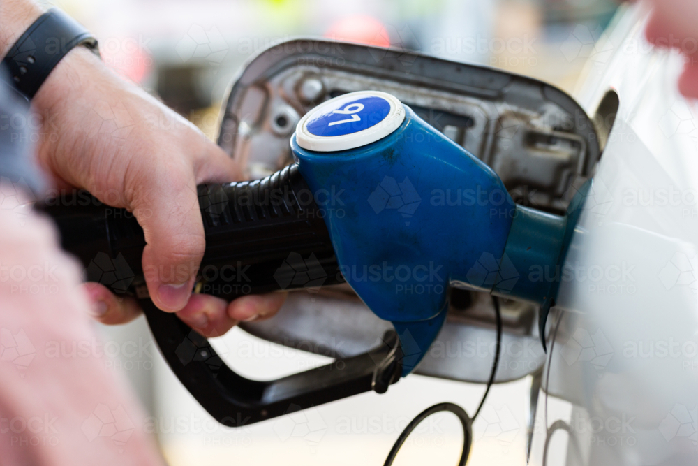 Image of Service station fuel pump detail of nozzles for unleaded 91 ...