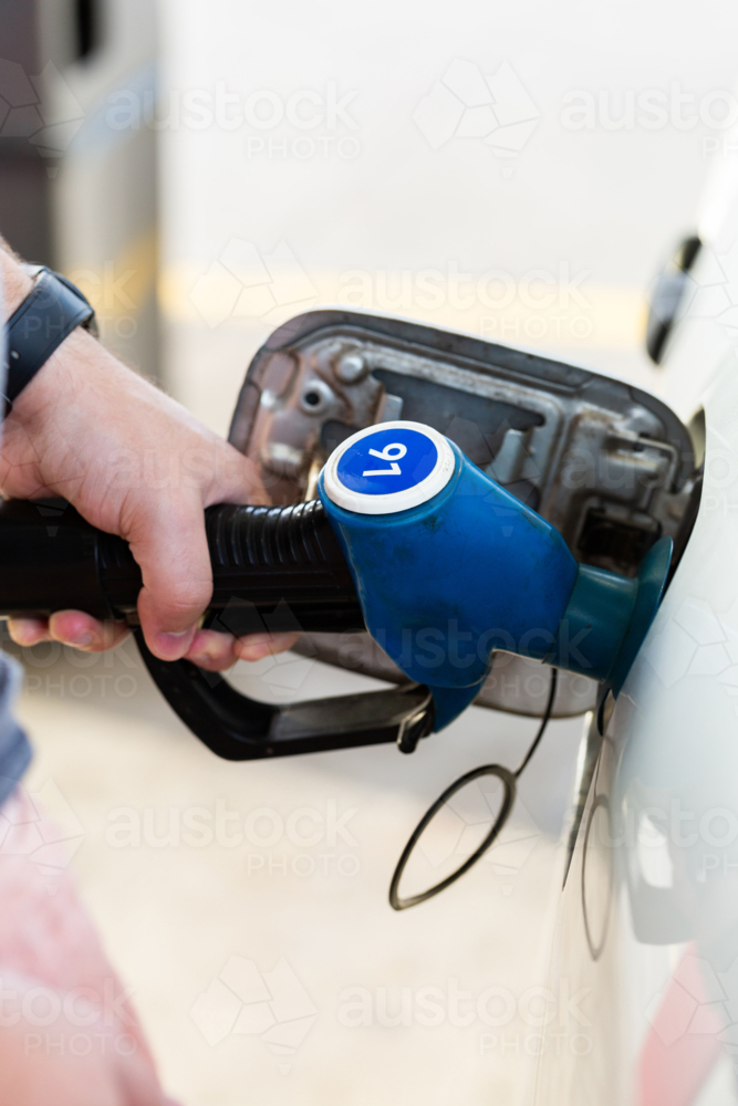 Image of Service station fuel pump detail of nozzles for unleaded 91 ...