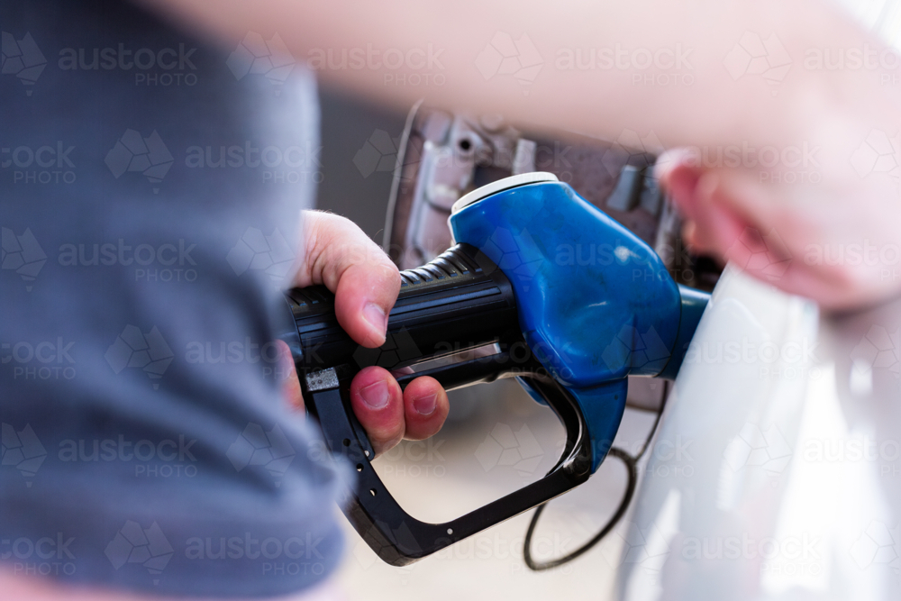 Image of Service station fuel pump detail of nozzles for unleaded 91 ...