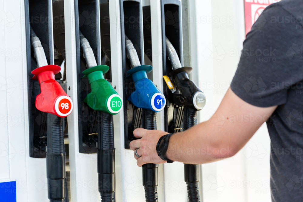 Image of Service station fuel pump with nozzles for selection of petrol ...