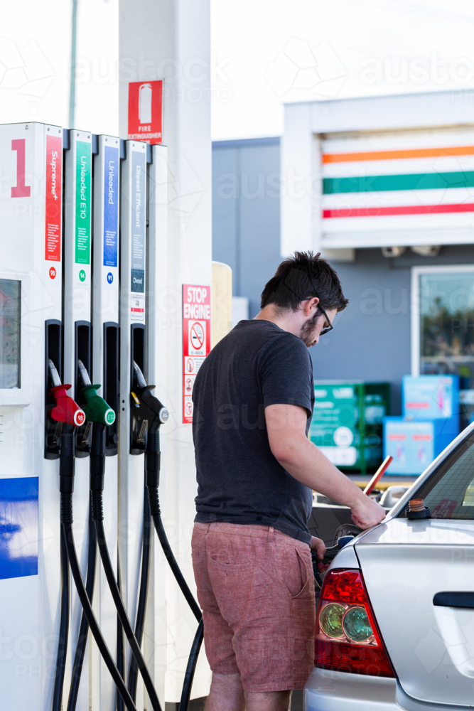 Image of Service station fuel pump with nozzles for selection of petrol ...